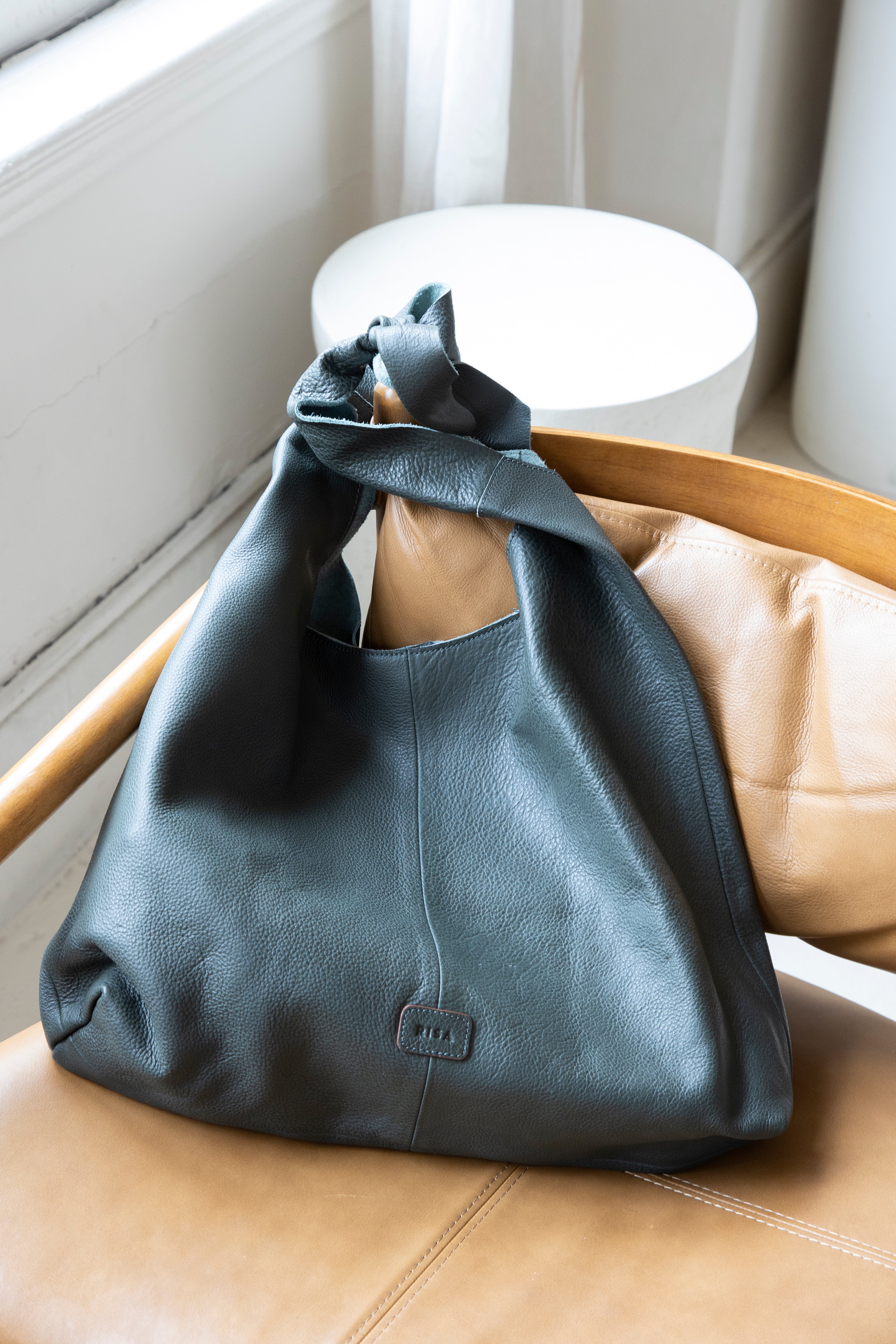 Discover the Timeless Elegance of Risa Vancouver's Knot Bags: Where Du – RISA VANCOUVER